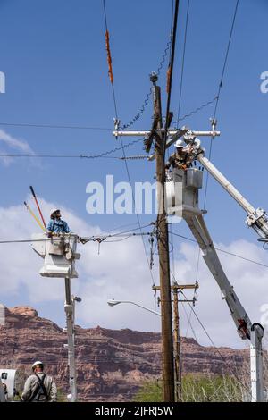 Electrical workers make perform maintenance on live electrical ...