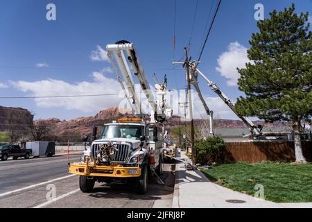 Electrical workers make perform maintenance on live electrical ...