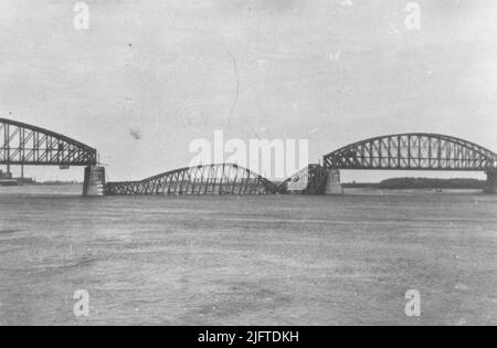 Blown middle arch of the railway bridge Stock Photo - Alamy