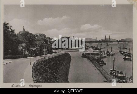 View of the Waalkade and the railway bridge Stock Photo - Alamy