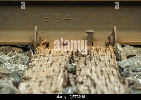 Bolts on a train track used by commuter and freight trains in a ...