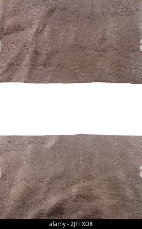 Two pieces of brown leather with a space for text isolated on white ...