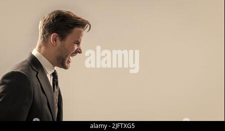 Businessman sideway shout angry grey background copy space, anger Stock ...
