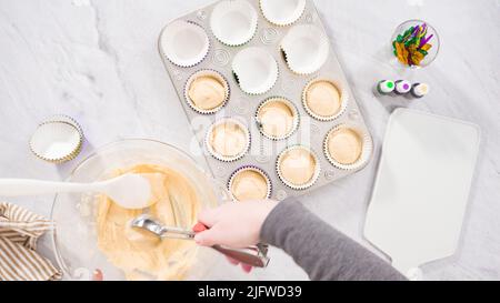 Step by step. Scooping cupcake batter into foil cupcake cups to bake ...