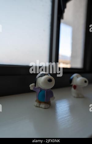 A selective focus shot of small Snoopy Dog model placed on the ...