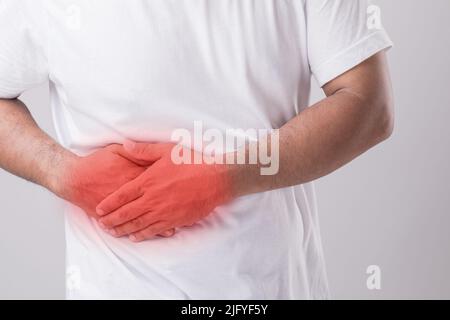 Liver or kidney problem concept : Close up man holding hand on belly ...