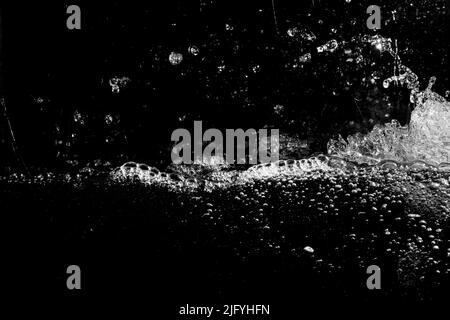 Abstract splashes of Rain and white particles on black background Stock ...