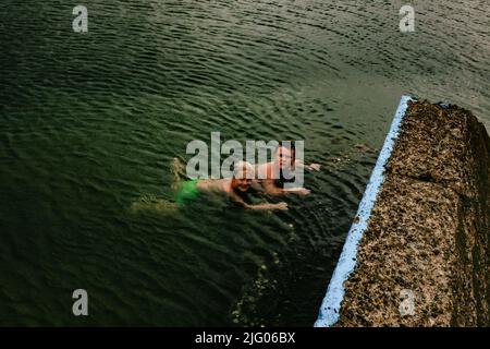Kids swimming in the Ocean Baths swimming pool at Forster, New South ...