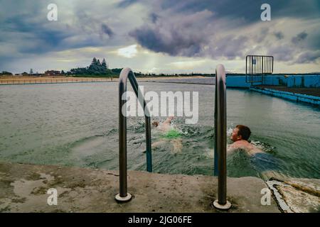 Kids swimming in the Ocean Baths swimming pool at Forster, New South ...
