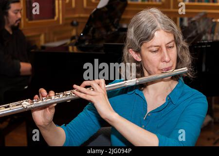A flautist playing a rehearsal piece for CoMA (Contemporary Music for ...