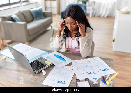 stressed woman with papers working at home office Stock Photo - Alamy