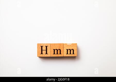 Hmm letters. Hmmm. Think about it. Written on three wooden blocks ...