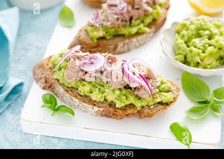 Toasts with canned tuna and avocado guacamole. Healthy food, diet ...