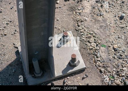 The Head of a bolt bolted on a steel metal plate with a washer in ...