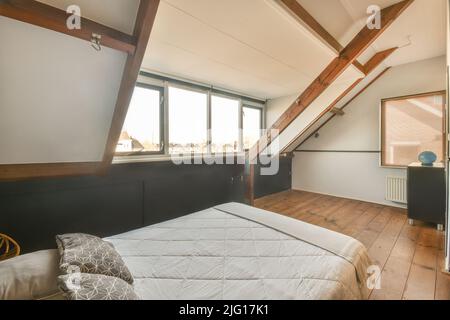 Comfortable bed placed near green wall in modern minimalist style ...