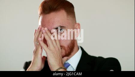 Perplexed man reaction with unbelief emotion. Person hiding face with ...