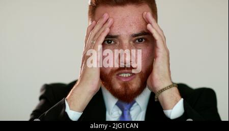 Perplexed man reaction with unbelief emotion. Person hiding face with ...