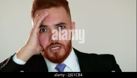 Perplexed man reaction with unbelief emotion. Person hiding face with ...