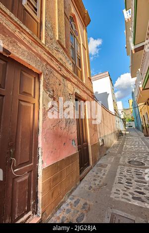 A scenic view of small vacation houses with dense colorful trees on the ...