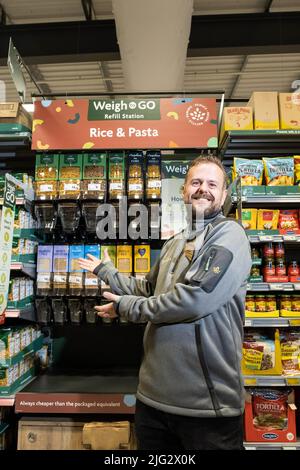 EDITORIAL USE ONLY Customer Assistant at Morrisons, Lee, serves jam ...