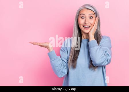 Photo of impressed cute girl dressed knit pullover enjoying good story ...