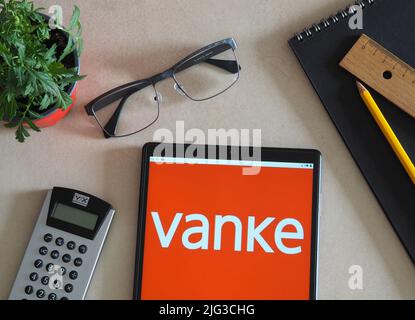 In this photo illustration, Vanke Co., Ltd. logo seen displayed on a ...
