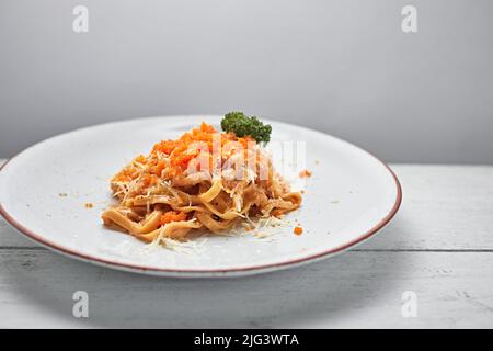 creamy sauce pasta with ebiko , selective focus Stock Photo - Alamy