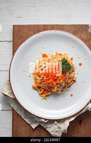 creamy sauce pasta with ebiko , selective focus Stock Photo - Alamy
