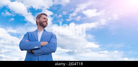 Portrait of grizzled guy sky background. Serious guy keeping arms ...