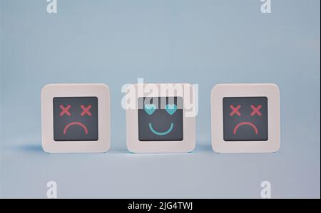 Set of computers with stylized faces of heart eyes and dead faces on ...