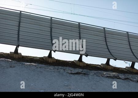 Fence by railroad. Road fence. Soundproof wall on railway Stock Photo ...