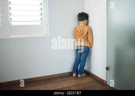 Child standing in the corner, facing the wall Stock Photo - Alamy