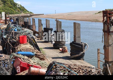 Lobster pots and other various pieces of fishing equipment piled up by ...