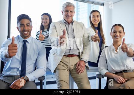 Doing great things together. a group of unrecognizable businesspeople ...