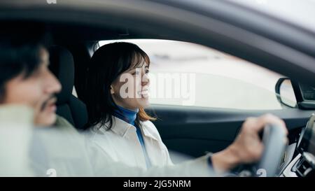 Japanese couple having a drive together Stock Photo - Alamy