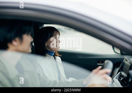 Japanese couple having a drive together Stock Photo - Alamy
