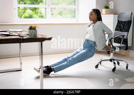 Triceps Dips Chair Exercise At Office Desk Stock Photo - Alamy
