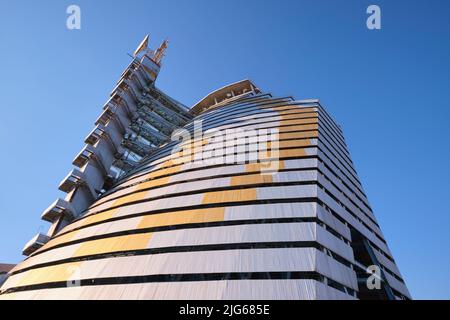 The silver banded curved back of the main reflector building at the ...