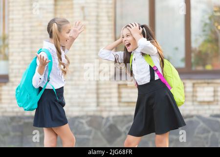 two school girls friends joking together outdoor Stock Photo - Alamy