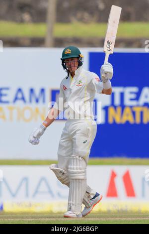 Australia's Marnus Labuschagne raises his bat after reaching his half ...