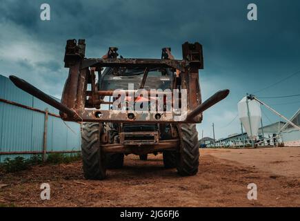 Red tractor with hoist on the farm. Equipment for agriculture. Close-up ...