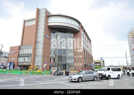 Police officers investigate the scene where Japan's former Prime ...