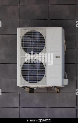 air conditioning unit Central split system hanging outside the building ...