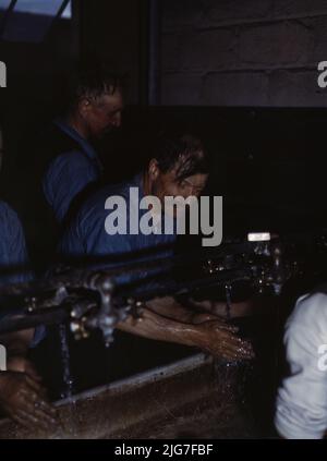 A 1940s photograph of John Sabados washing up after a day’s work at the Proviso Yard of the ...