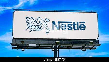 Advertisement billboard displaying logo of Nestle Stock Photo - Alamy