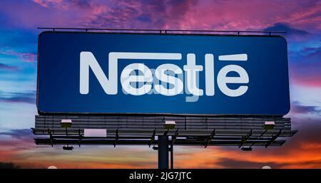 Advertisement billboard displaying logo of Nestle Stock Photo - Alamy