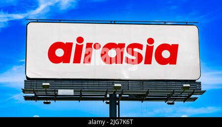 Advertisement billboard displaying logo of AirAsia Stock Photo - Alamy