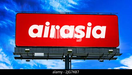 Advertisement billboard displaying logo of AirAsia Stock Photo - Alamy
