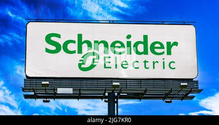 Advertisement billboard displaying logo of Schneider Electric Stock ...
