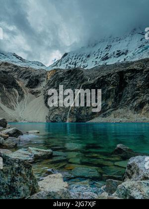 Vertical view of Lake 69, Huaraz, Peru under mountains Stock Photo - Alamy